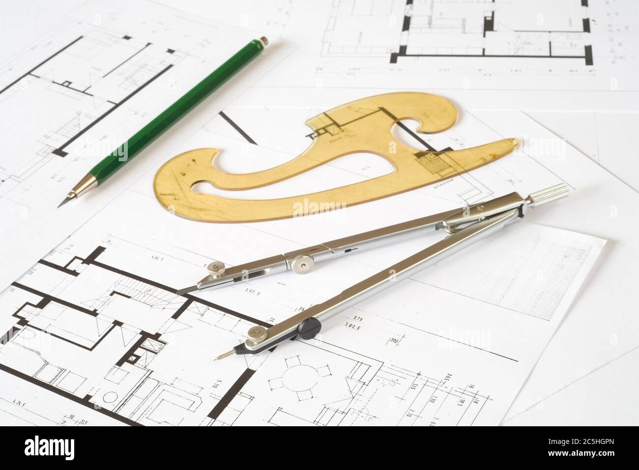 Architecture concept: building plan (fictional) , compasses, pencil ...