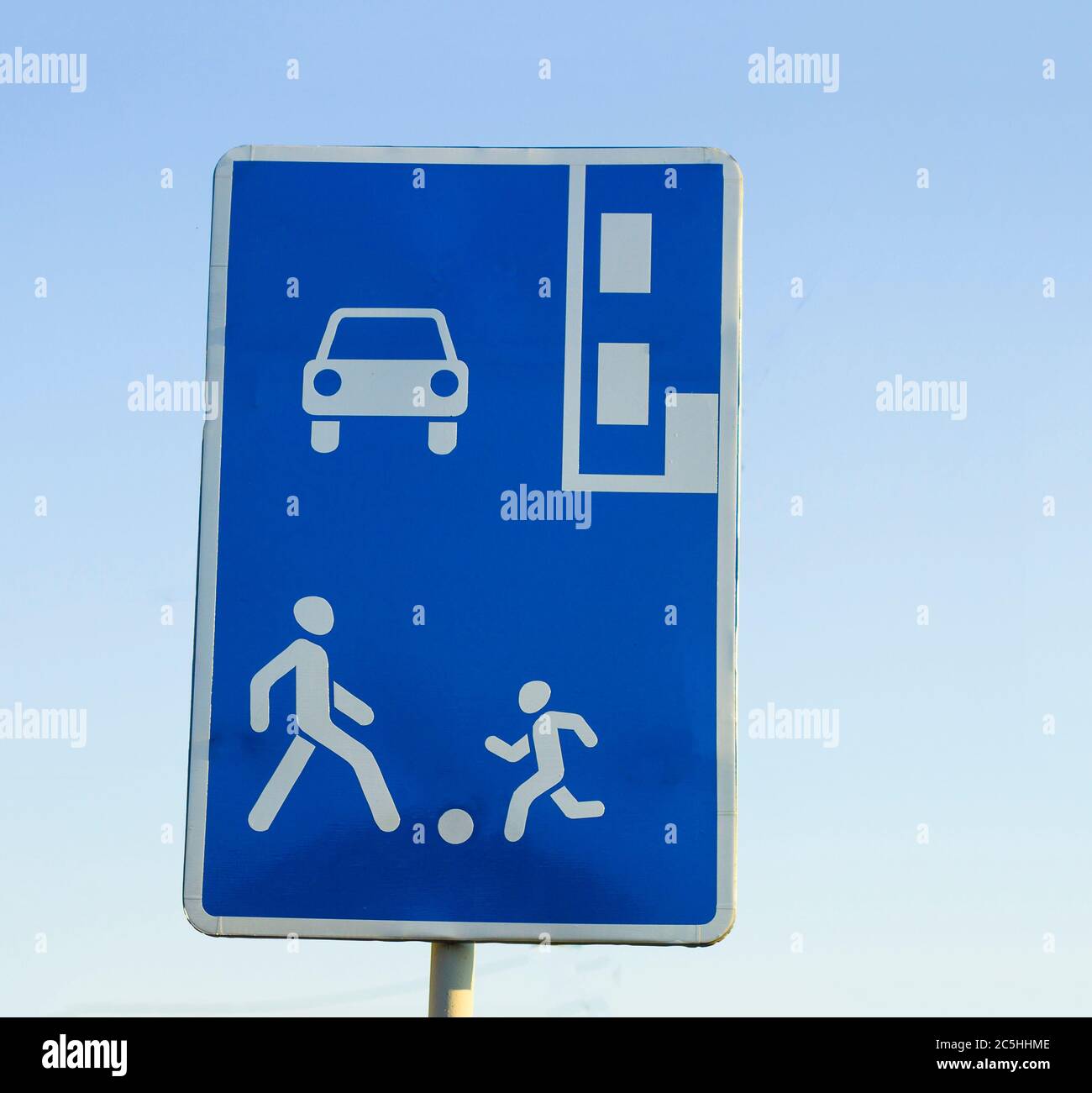 Information road sign, blue rectangular shield with human figures, car ...