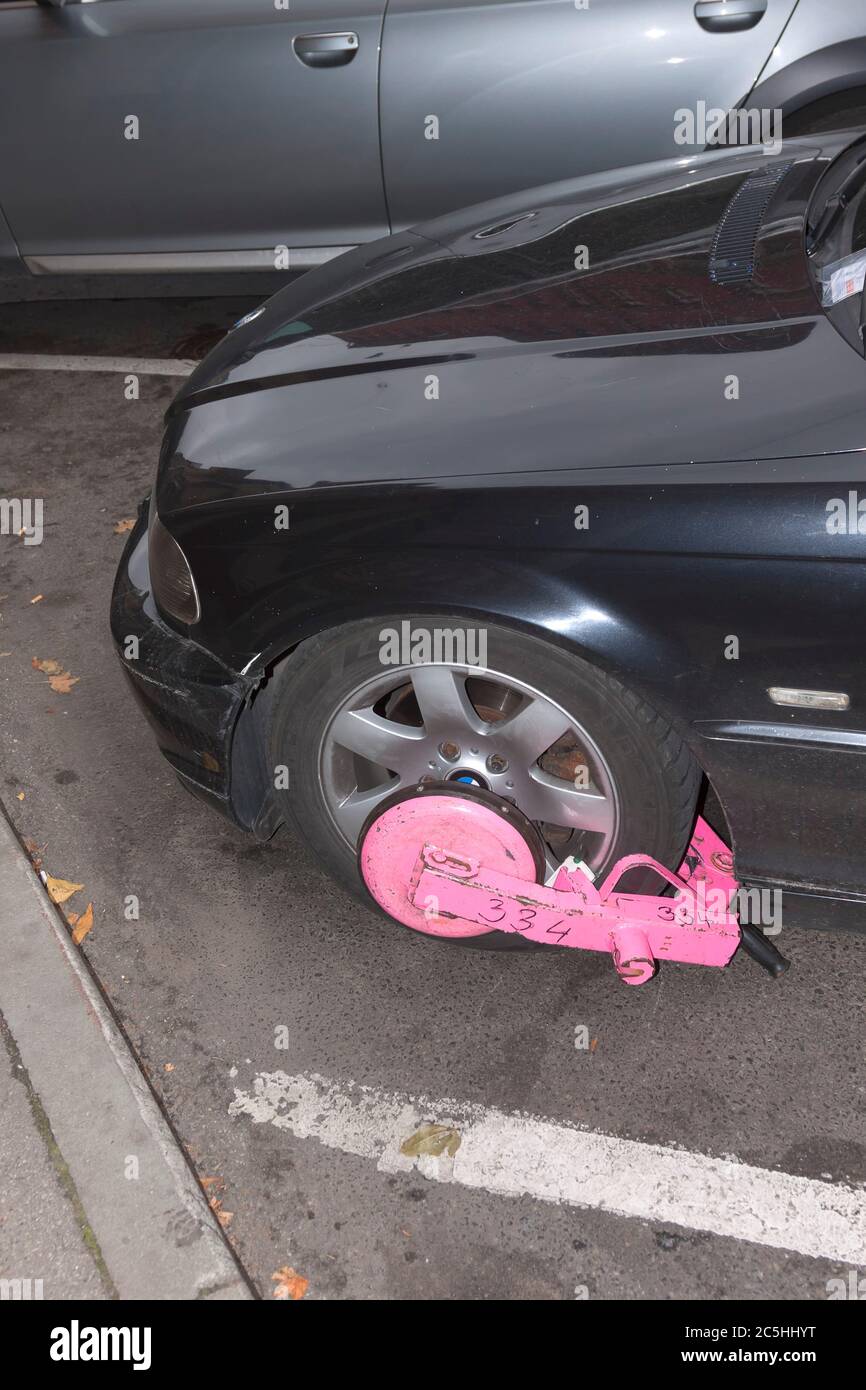 Wheel clamp, wheel boot, parking boot, or Denver boot is a device that ...