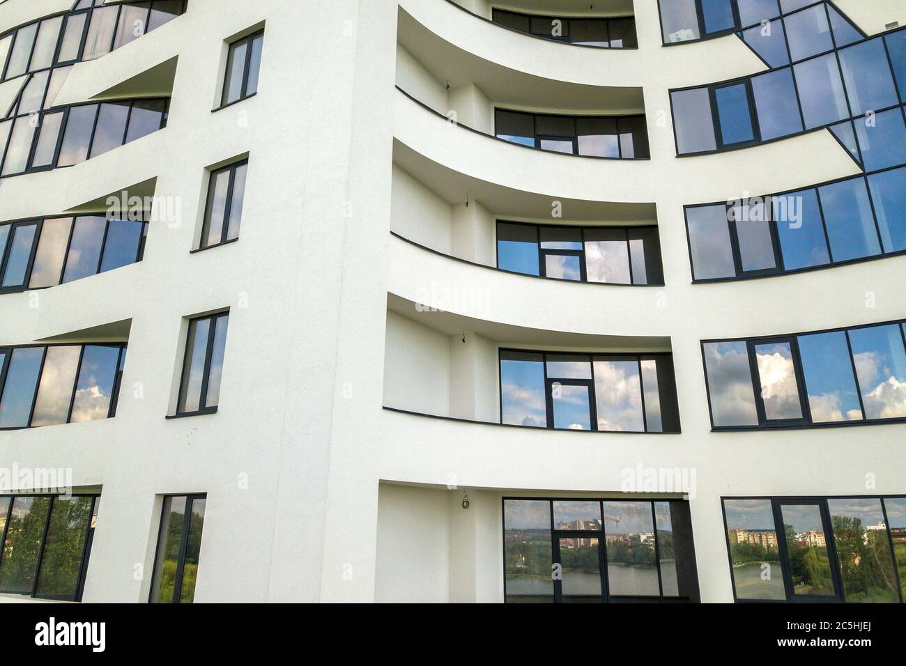 Many windows on new apartment building facade Stock Photo - Alamy