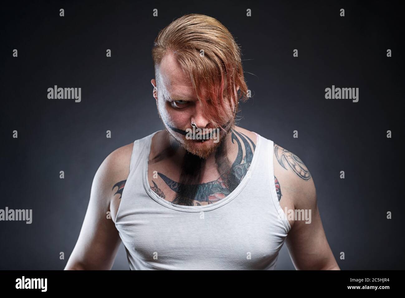 Tattooed scary mad with horror make up Stock Photo - Alamy