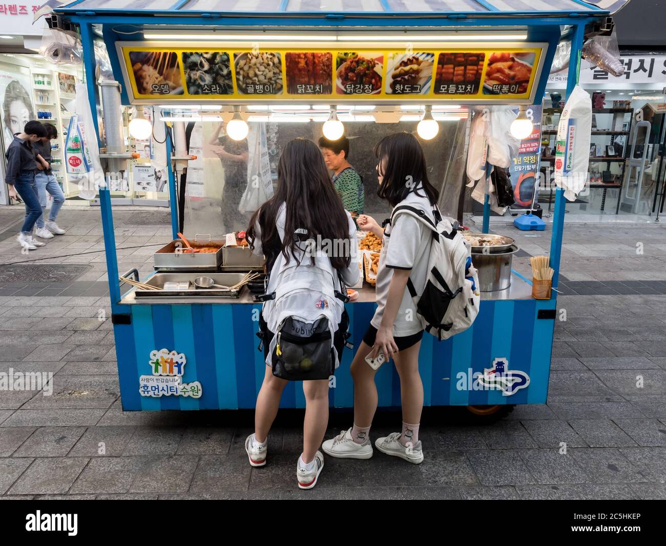 Suwon, South Korea - June 15, 2017: Two young women buy fast food in ...