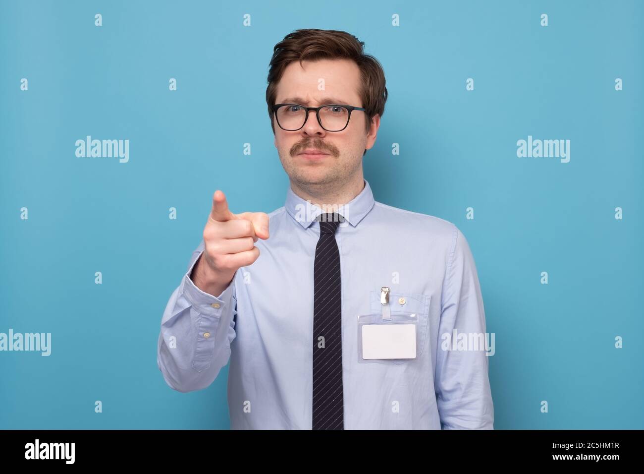 Young business man seriously pointing at you Stock Photo - Alamy