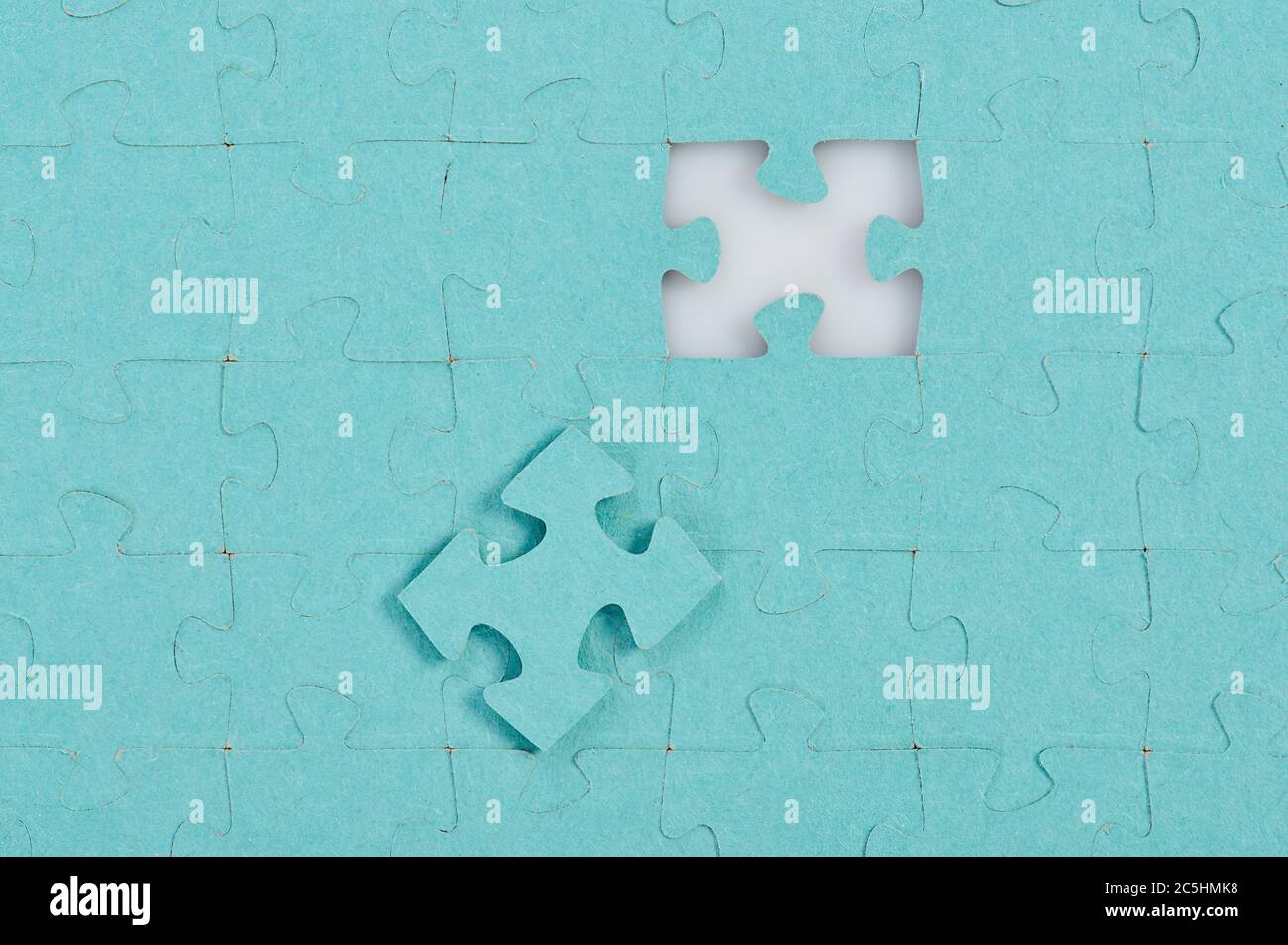 Macro of missing spot on assembly puzzle game Stock Photo - Alamy