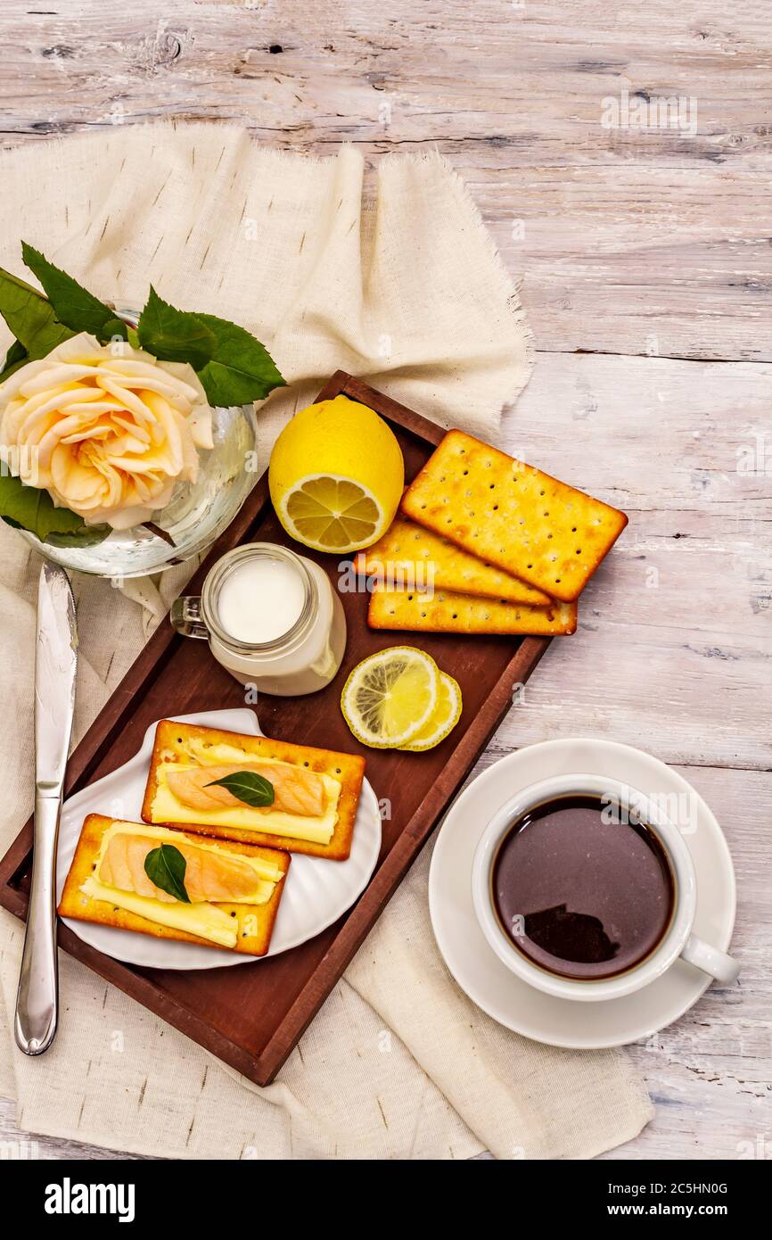Healthy breakfast. Cup of coffee (black tea), milk, crackers with ...