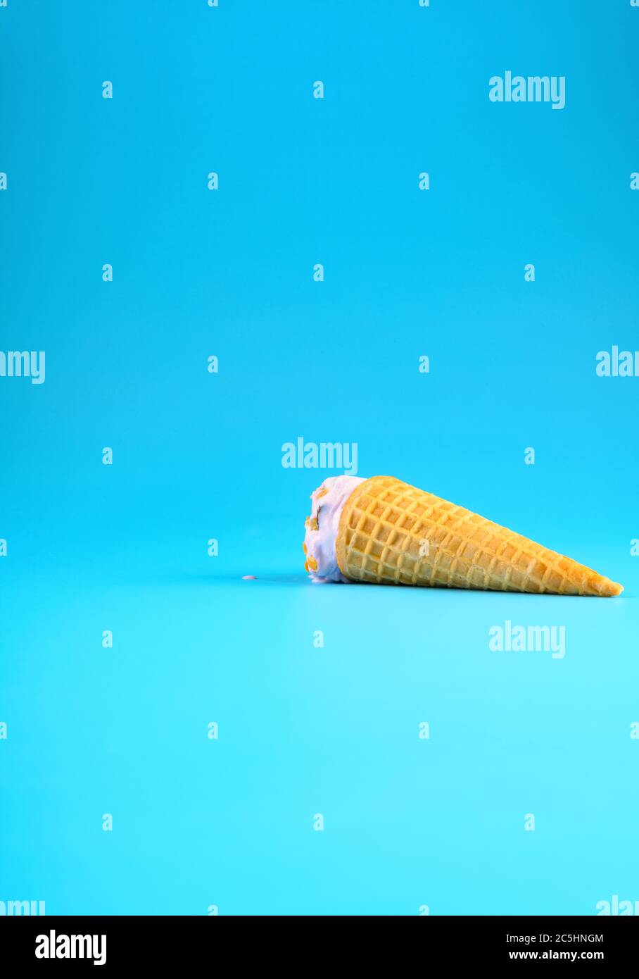 Sweet Potato Flavor Ice Cream Cone In A Melting Process On Blue