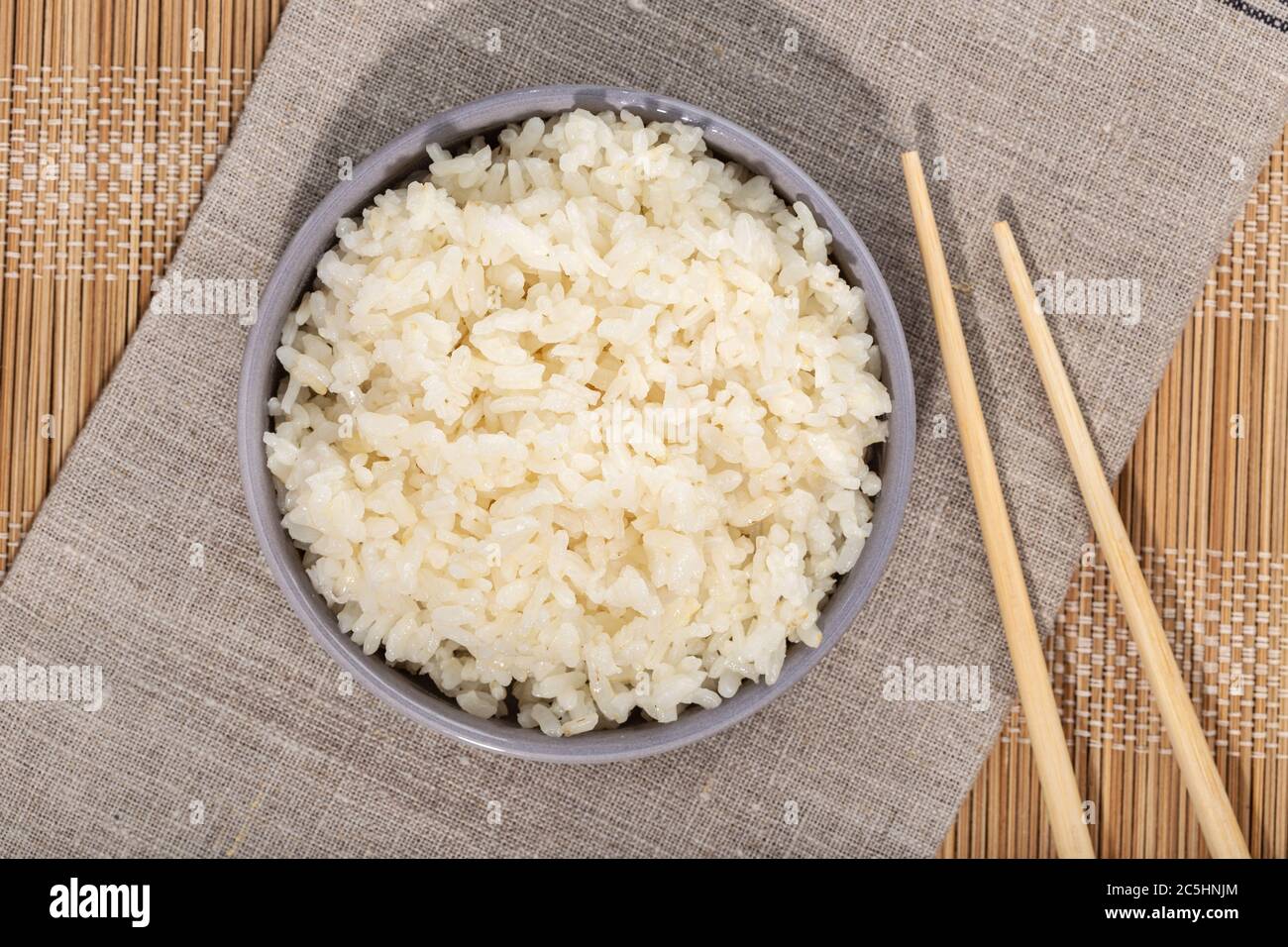 Cooked rice in bowl still life. Top view Stock Photo - Alamy