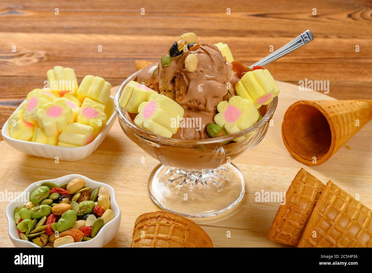 side view bowl of chocolate flavor ice cream with marshmallows and ...