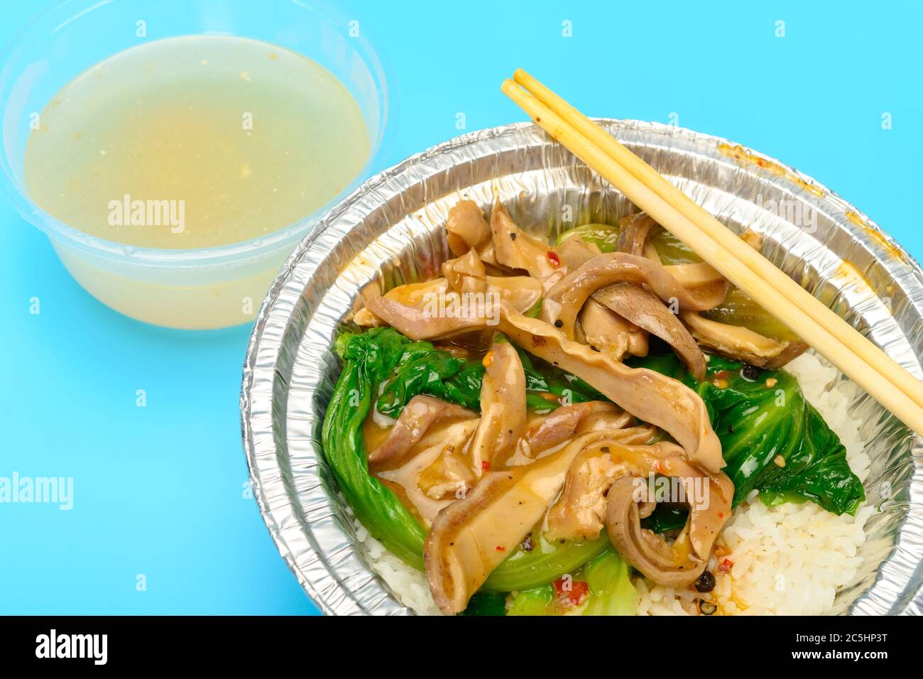 side view fast food of pig stomach and cabbage with soup on blue ...