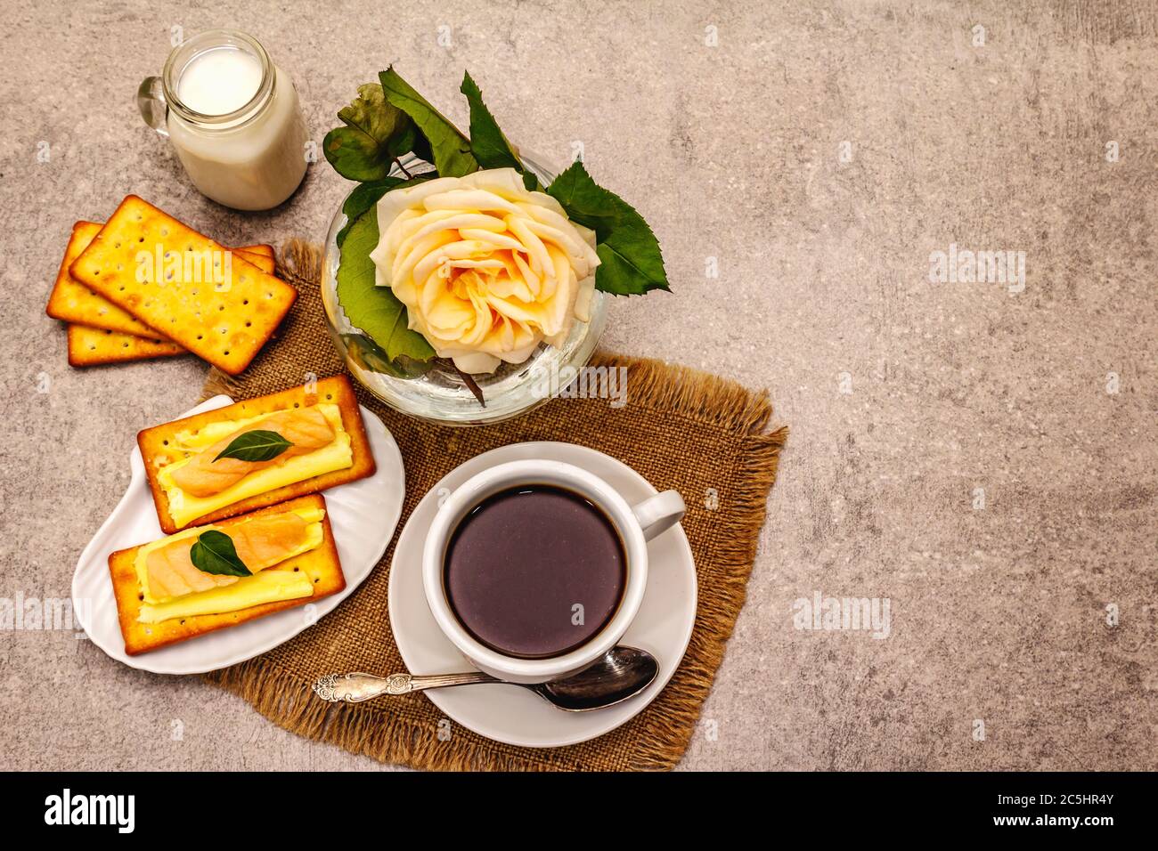 Healthy breakfast. Cup of coffee (black tea), milk, crackers with ...