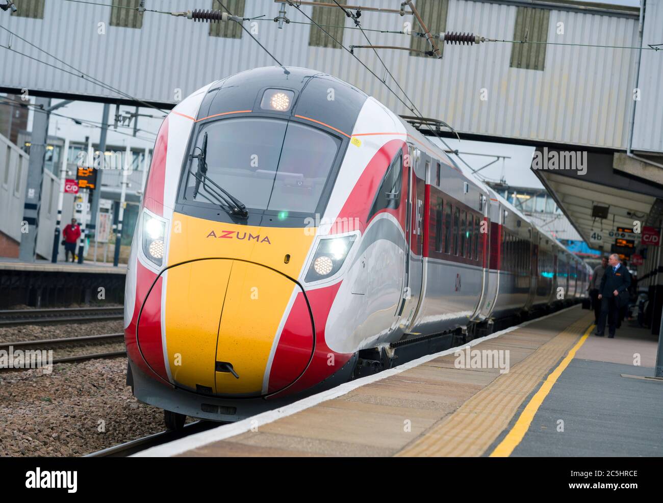LNER Azuma high speed train waiting at a railway station on the east coast main line, England ...