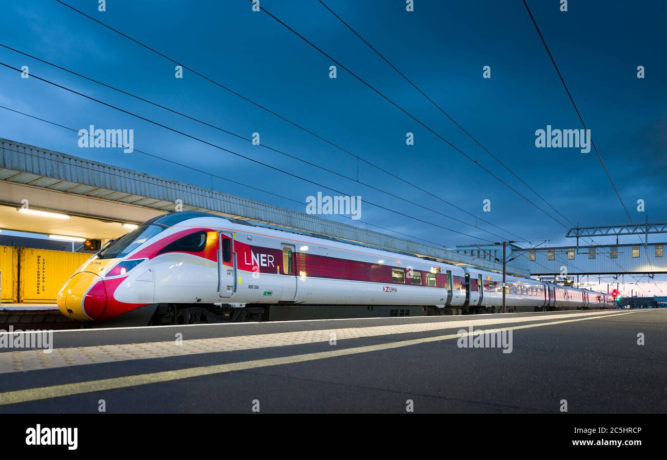 LNER Azuma high speed train waiting at a railway station on the east ...