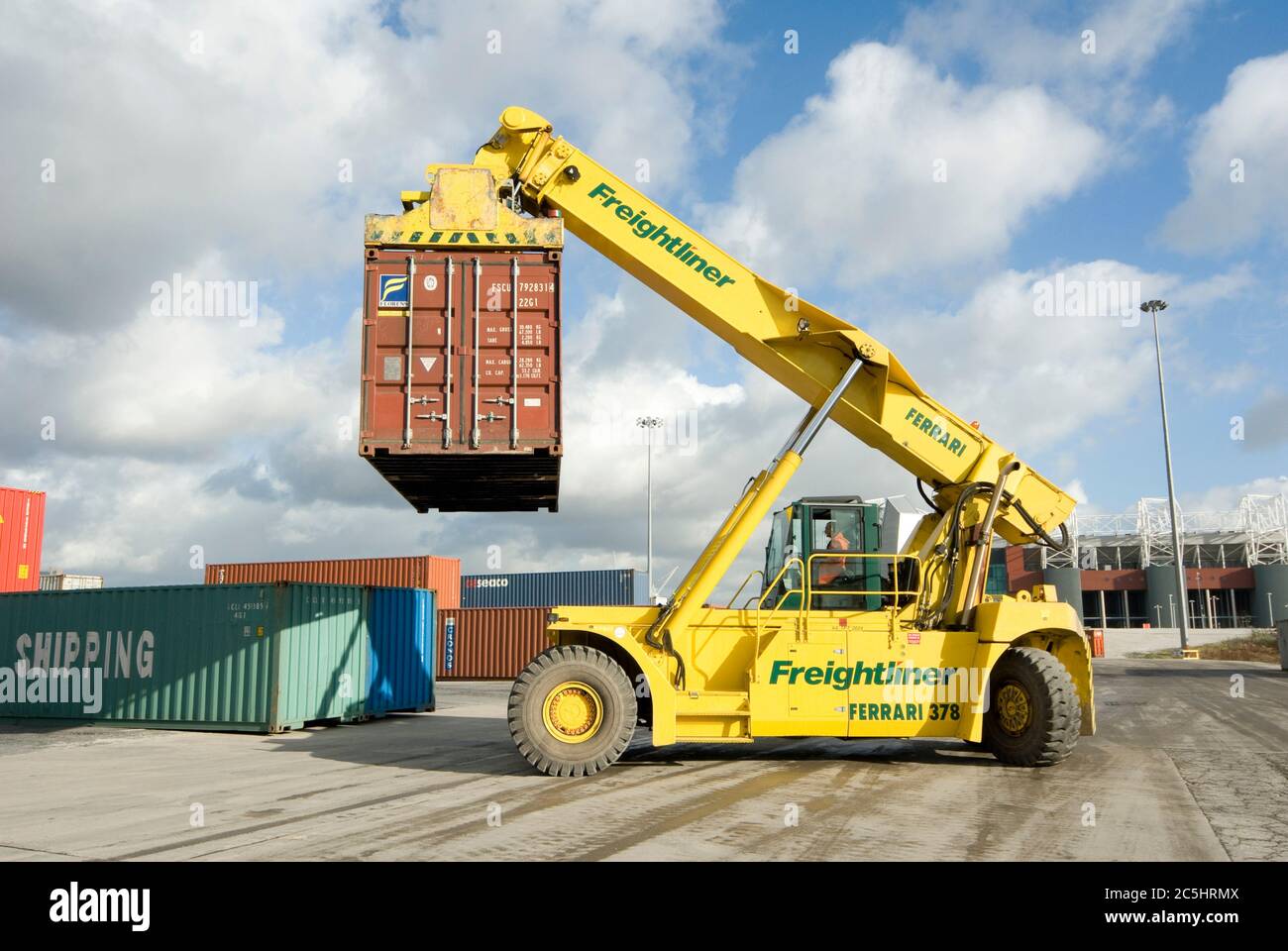 CVS Ferrari reach stacker being used to move shipping containers at ...