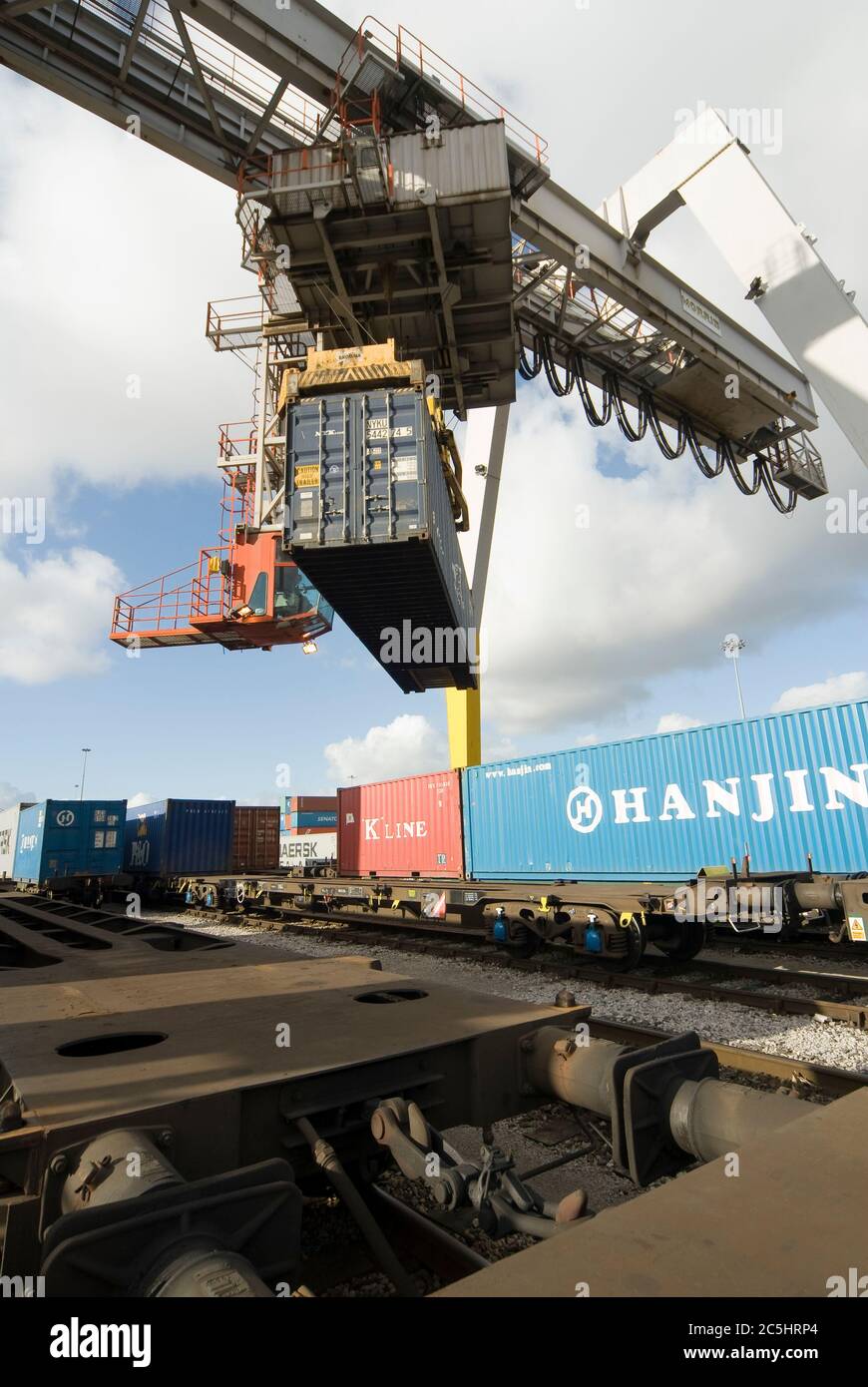Rail mounted crane being used to load and unload shipping containers at ...