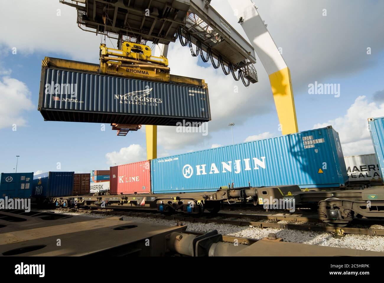 Rail mounted crane being used to load and unload shipping containers at ...