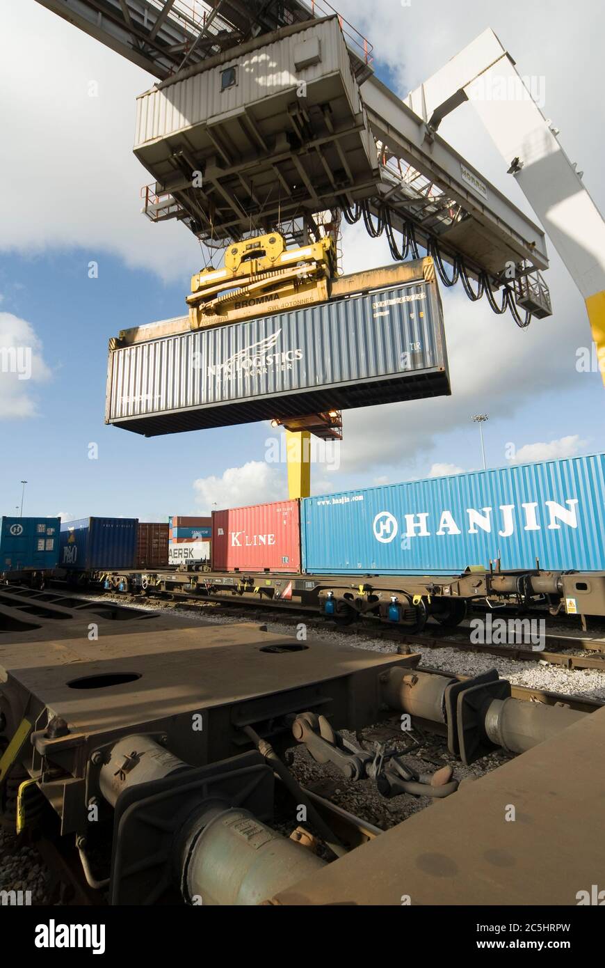Rail mounted crane being used to load and unload shipping containers at ...