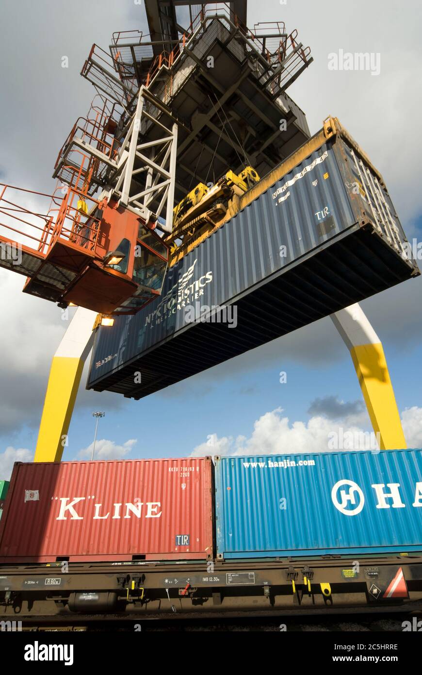 Rail mounted crane being used to load and unload shipping containers at ...
