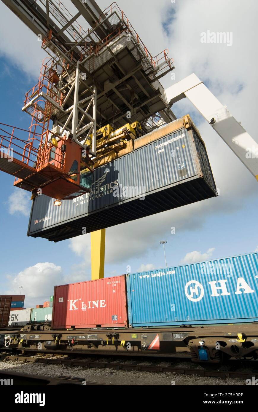 Rail mounted crane being used to load and unload shipping containers at ...