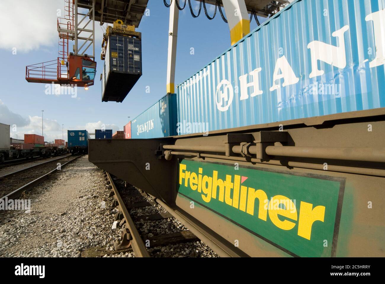 Rail mounted crane being used to load and unload shipping containers at ...
