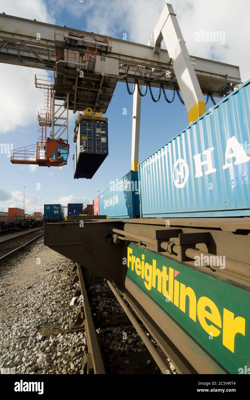 Rail mounted crane being used to load and unload shipping containers at ...