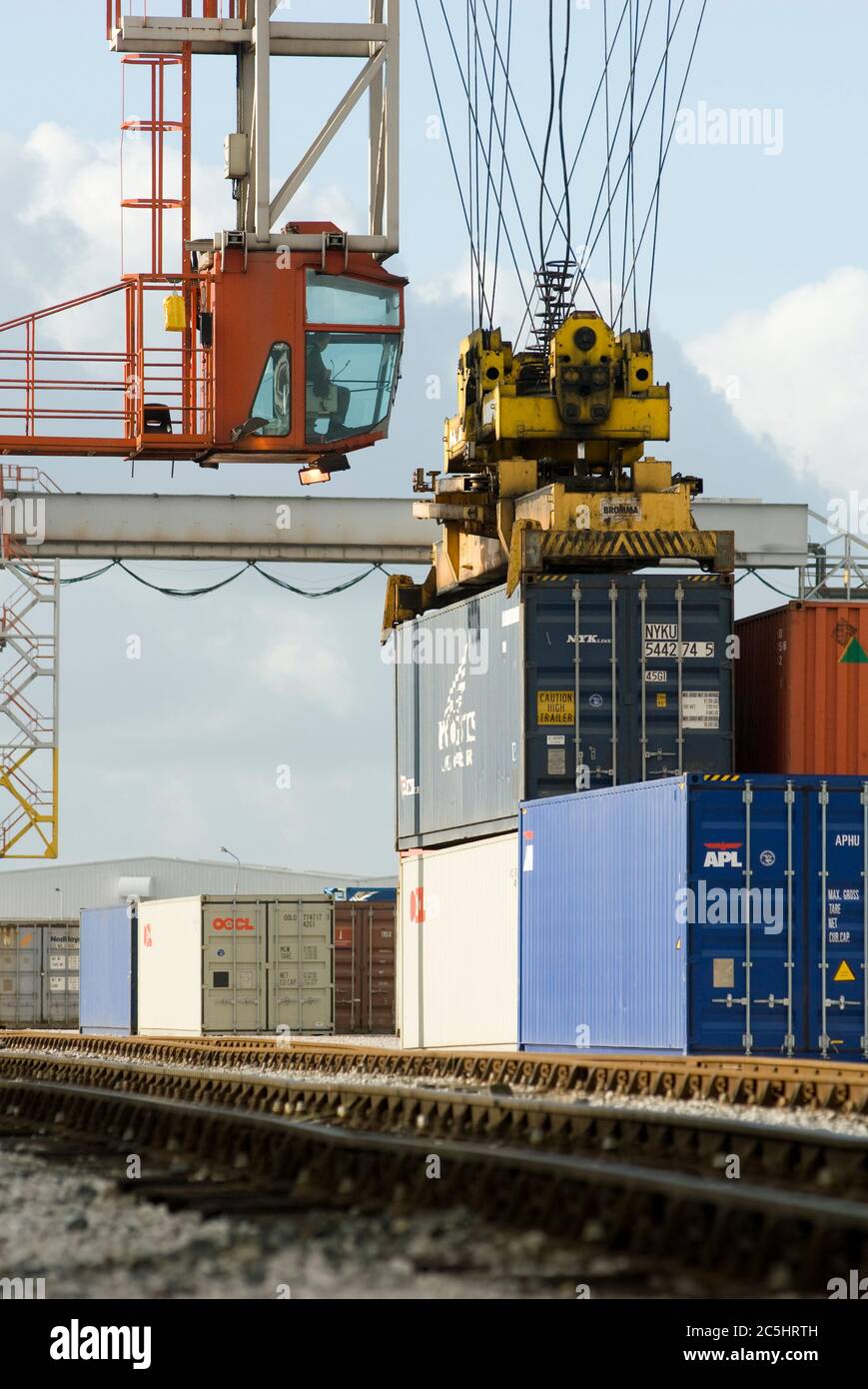 Rail mounted crane being used to load and unload shipping containers at ...
