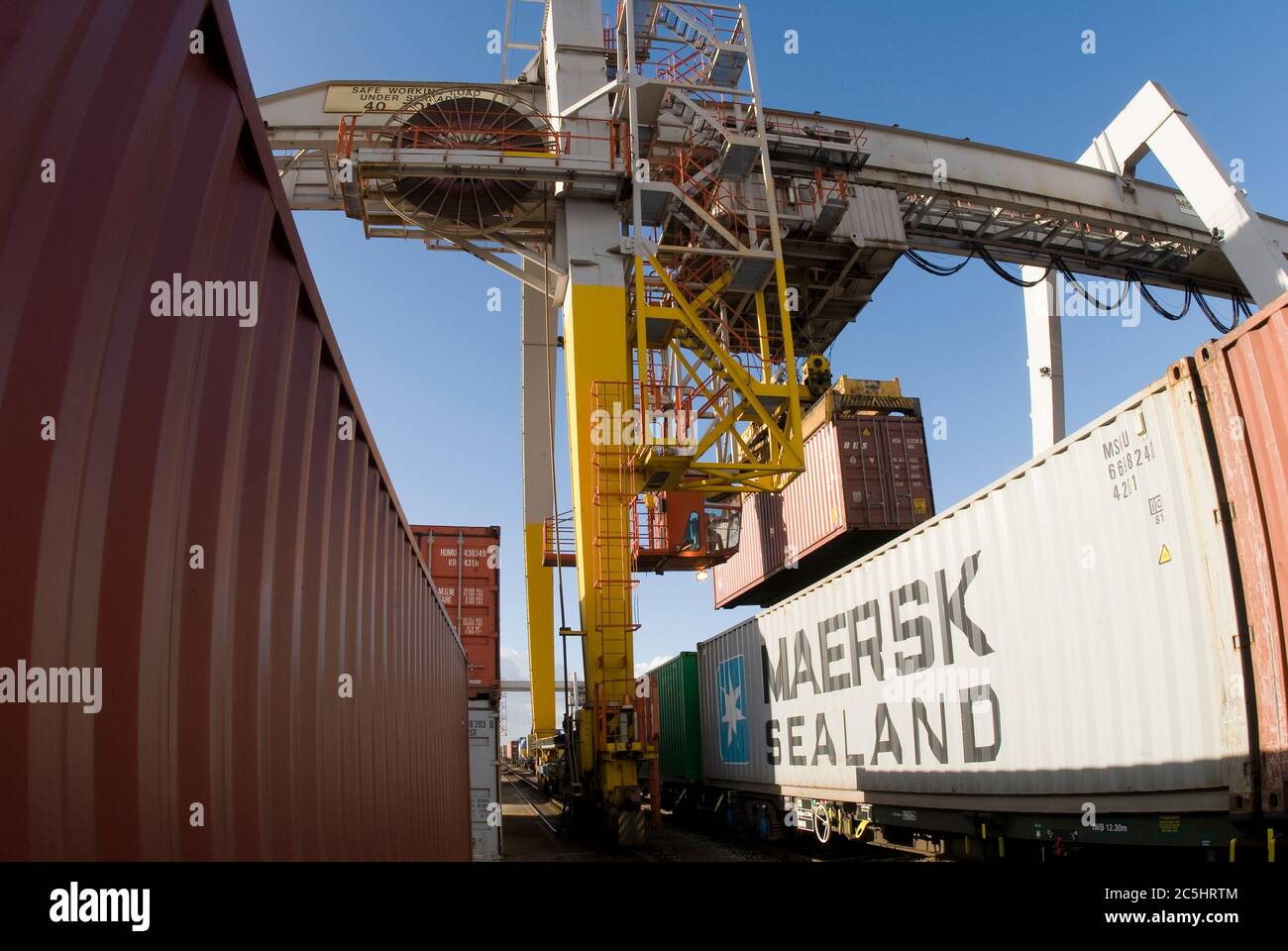 Rail mounted crane being used to load and unload shipping containers at ...