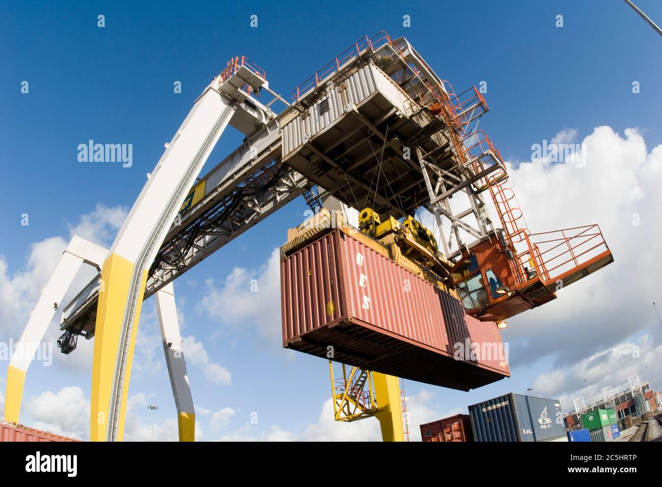 Rail mounted crane being used to load and unload shipping containers at ...