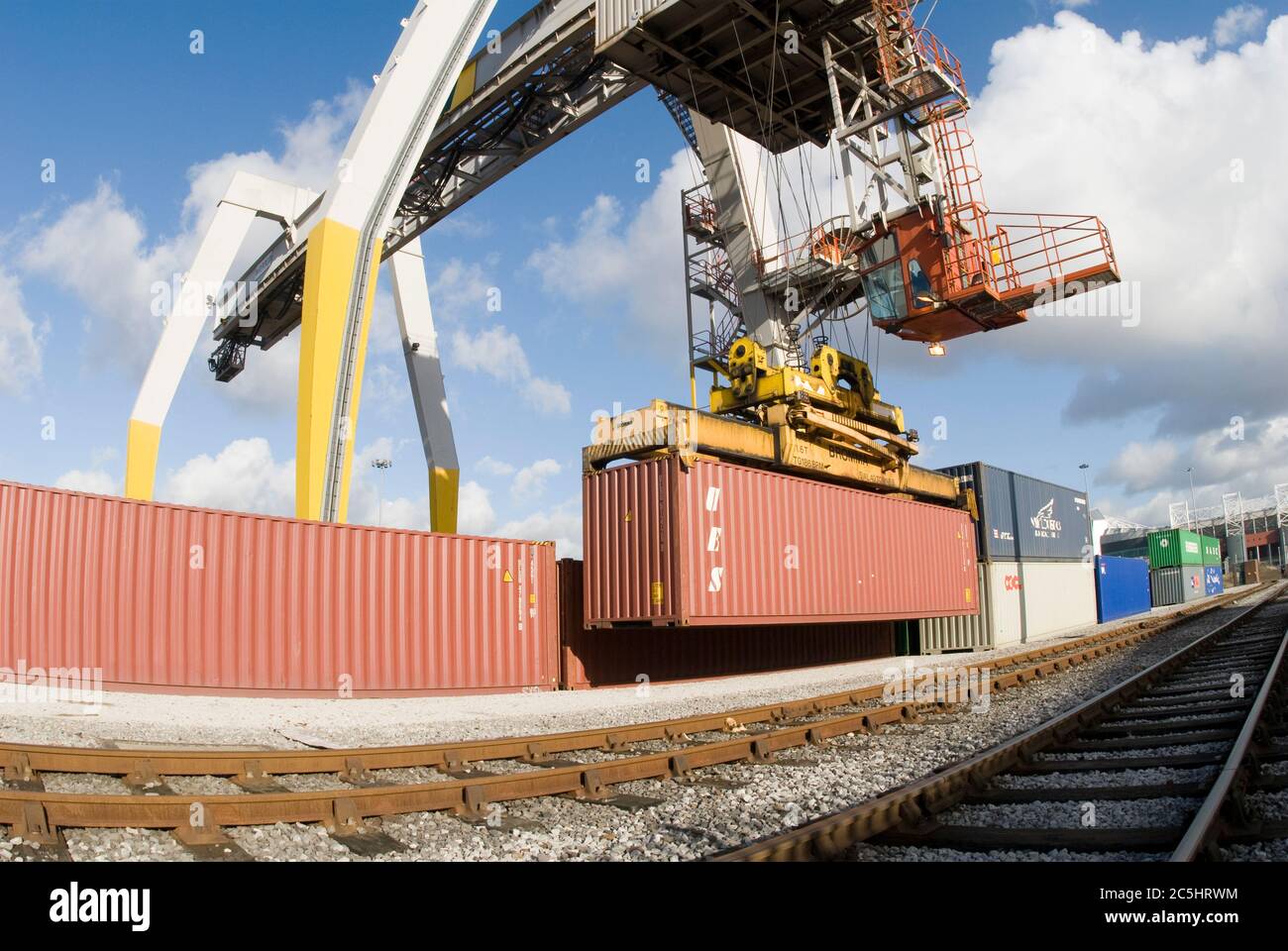 Rail mounted crane being used to load and unload shipping containers at ...