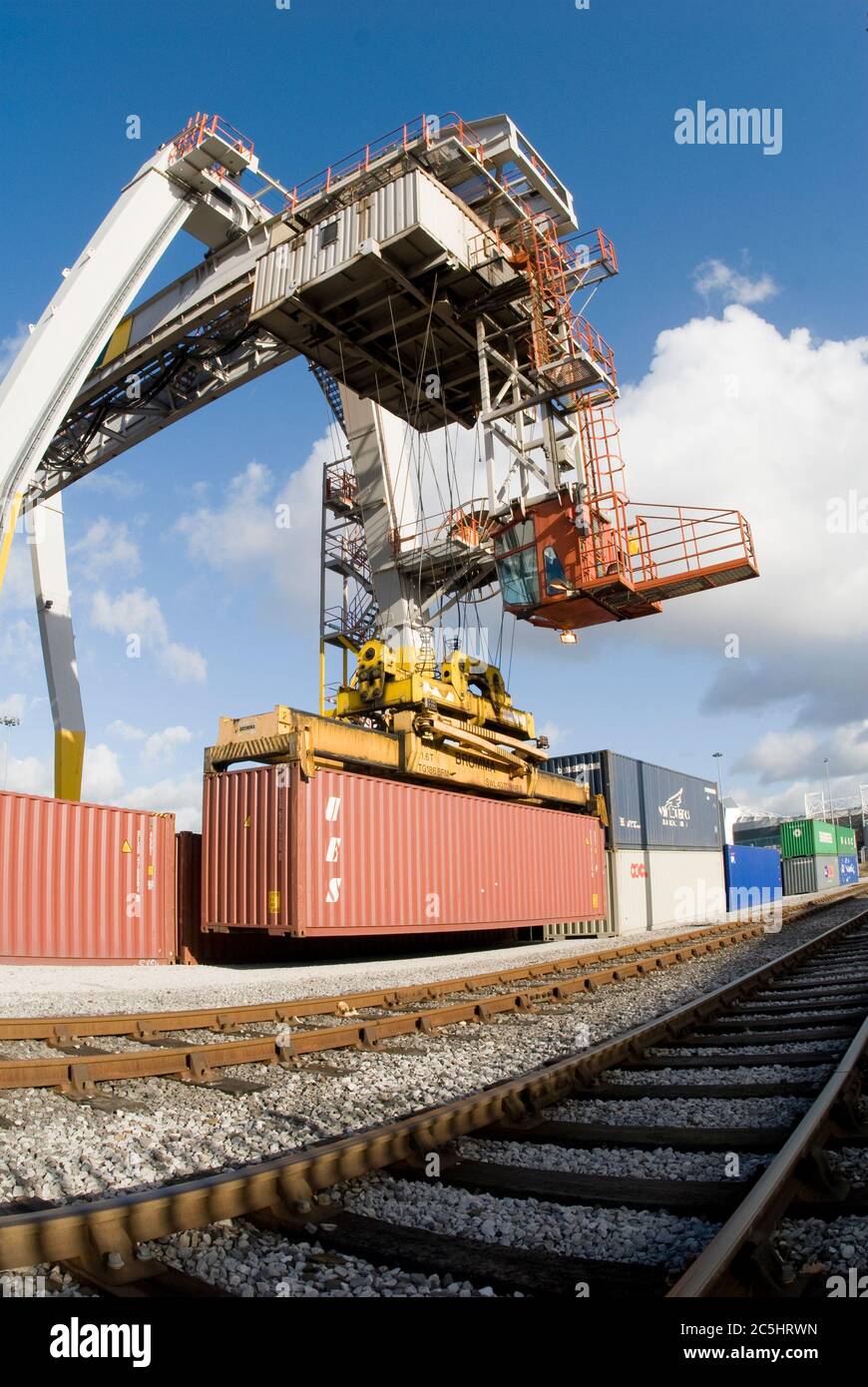 Rail mounted crane being used to load and unload shipping containers at ...