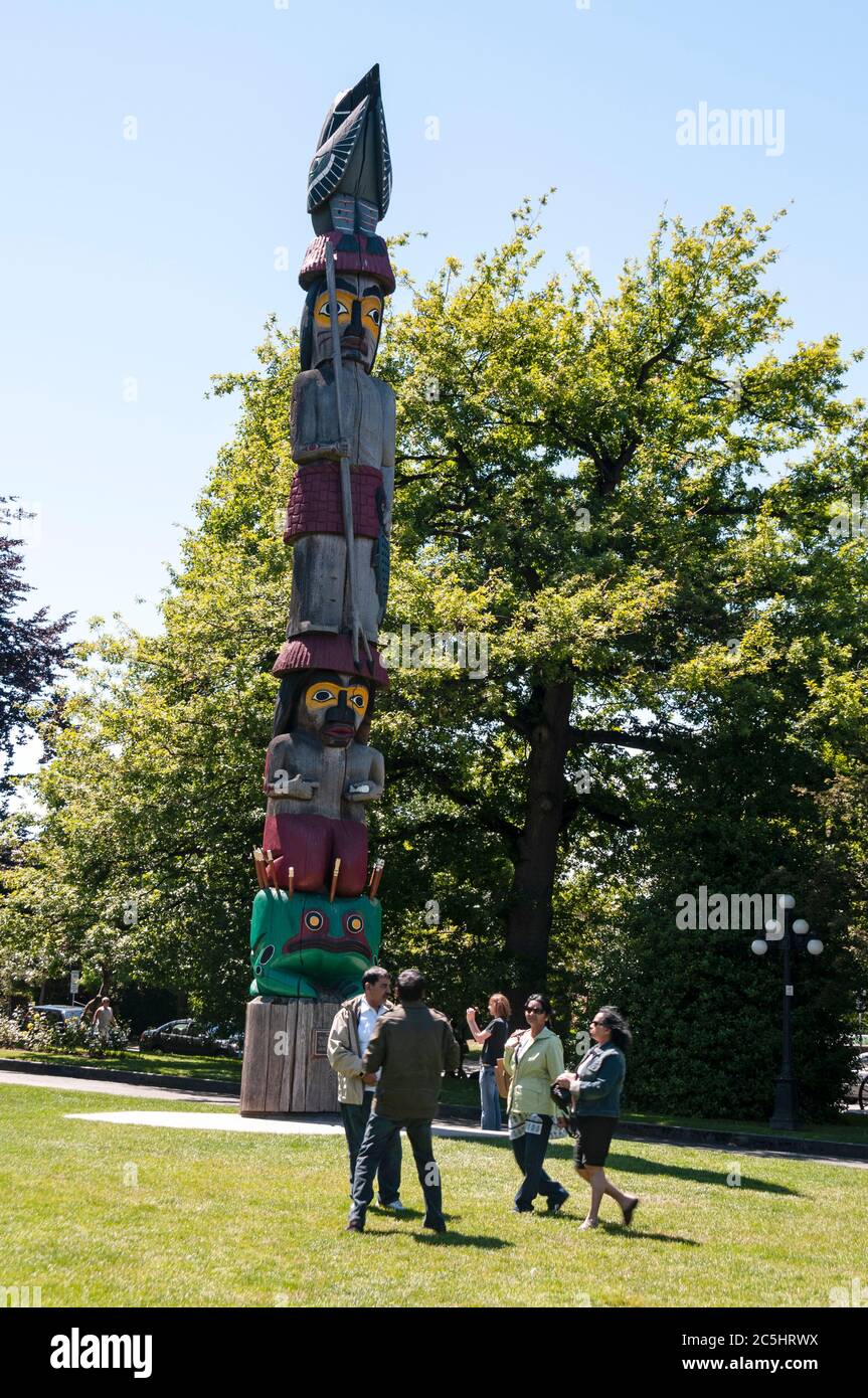 A First Nation Totem Pole, a hand carved decorated wooden pole in the ...
