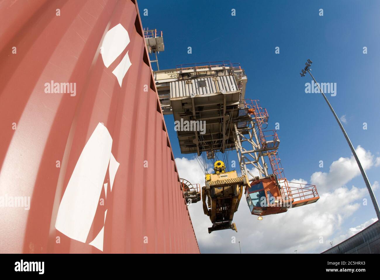 Rail mounted crane being used to load and unload shipping containers at ...