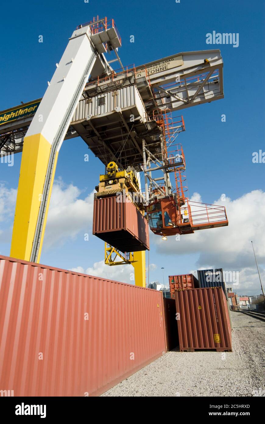 Rail mounted crane being used to load and unload shipping containers at ...