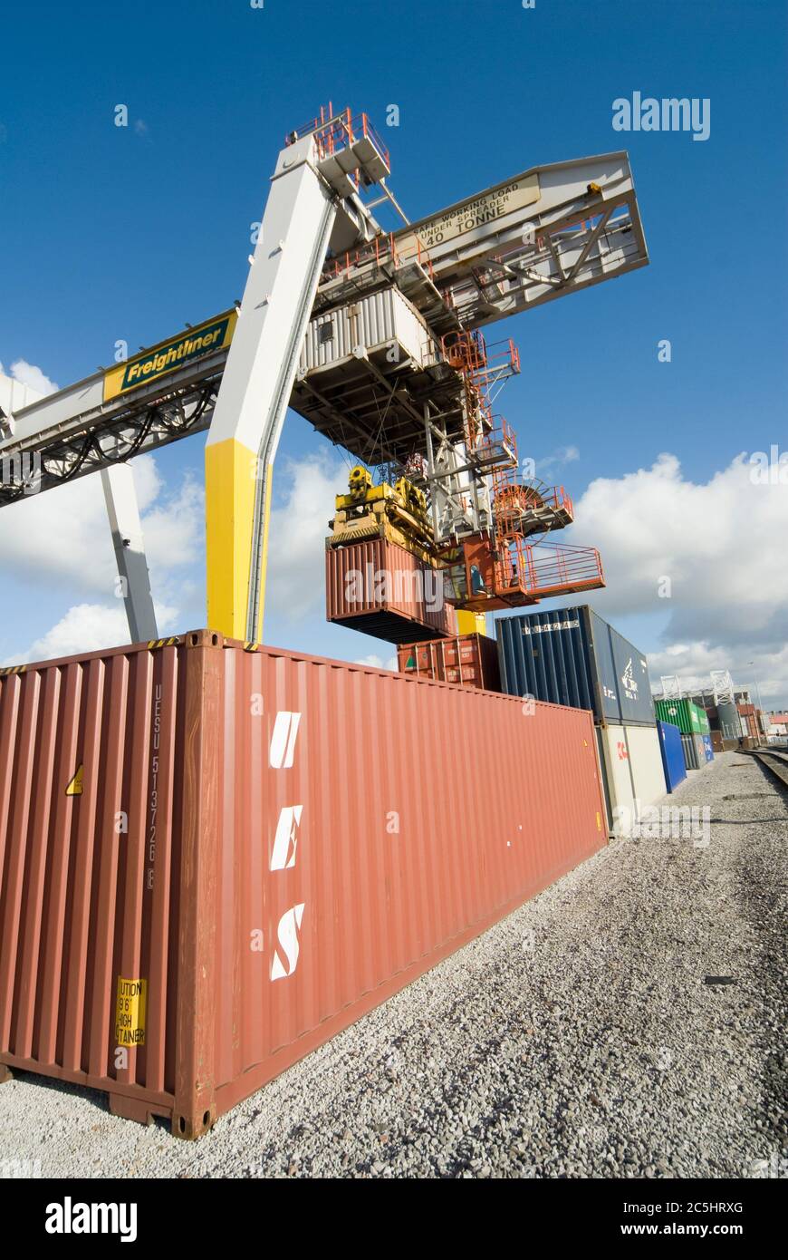 Rail mounted crane being used to load and unload shipping containers at ...