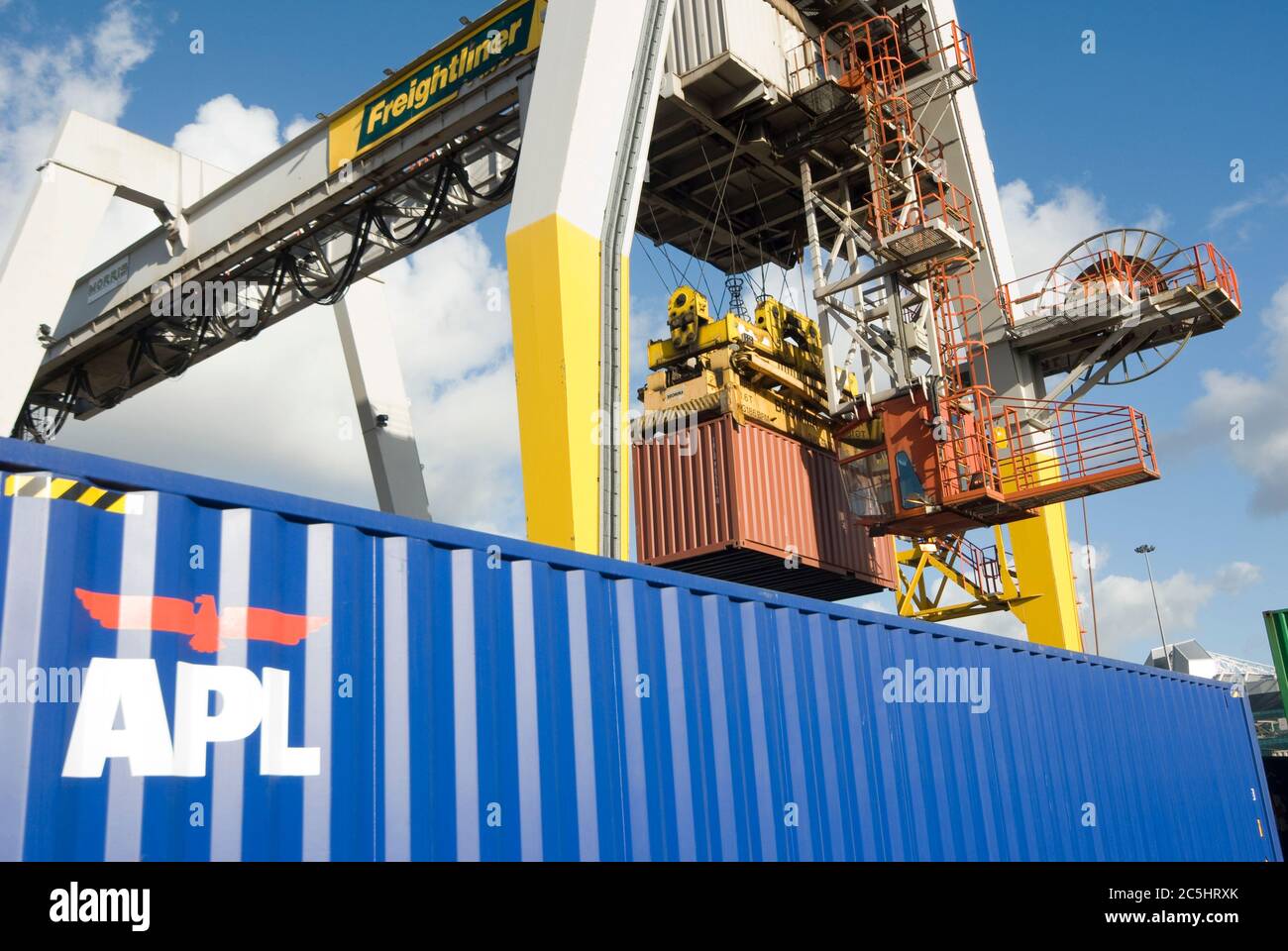Rail mounted crane being used to load and unload shipping containers at ...