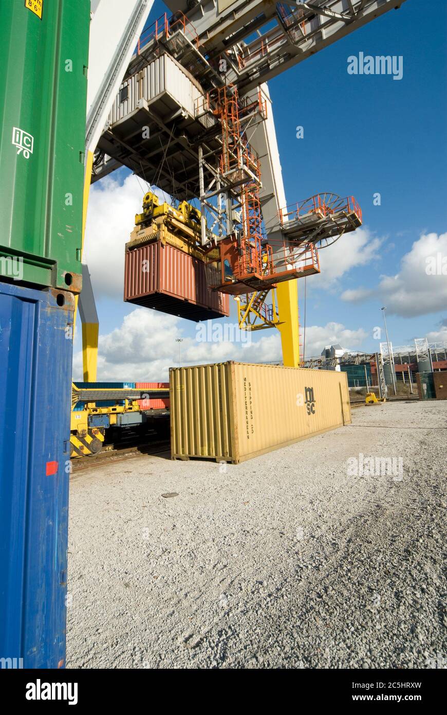 Rail mounted crane being used to load and unload shipping containers at ...