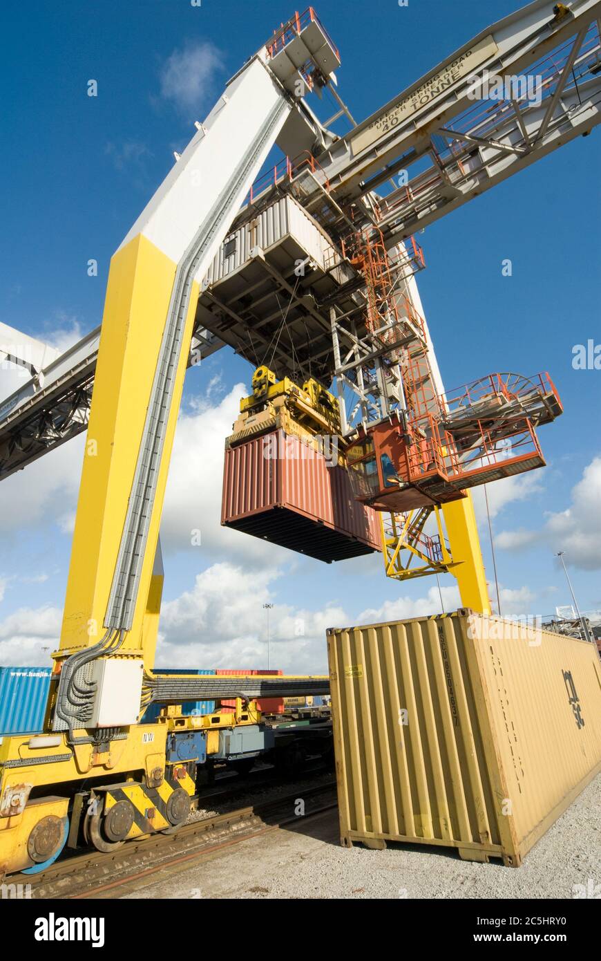 Rail mounted crane being used to load and unload shipping containers at Manchester Euroterminal ...