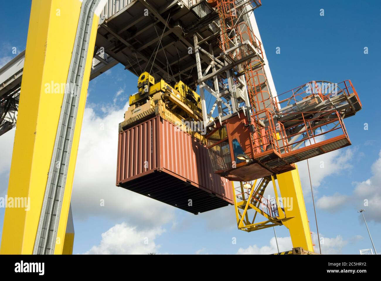 Rail mounted crane being used to load and unload shipping containers at ...