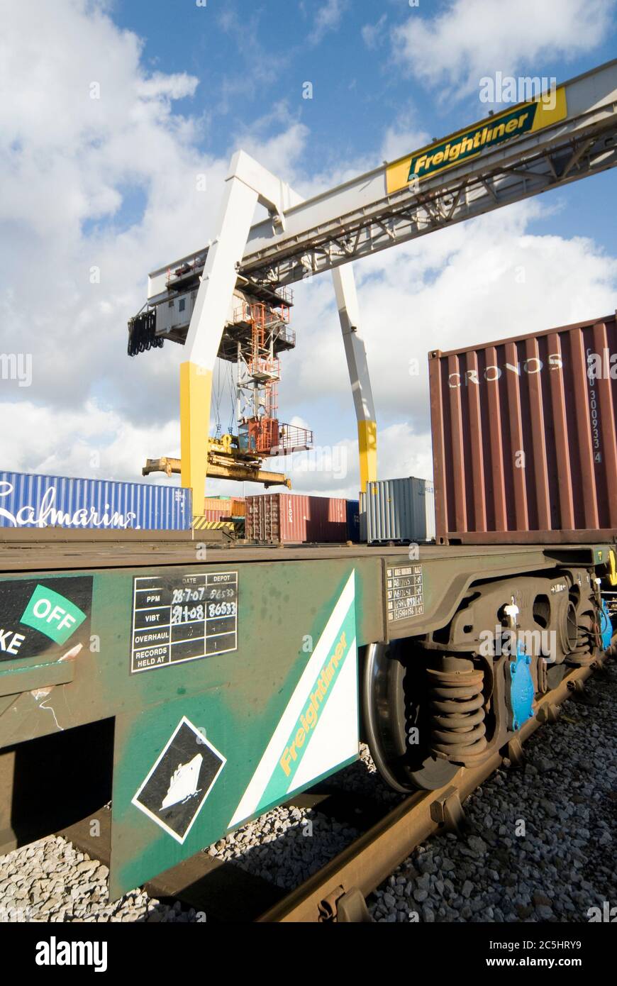Rail mounted crane being used to load and unload shipping containers at ...