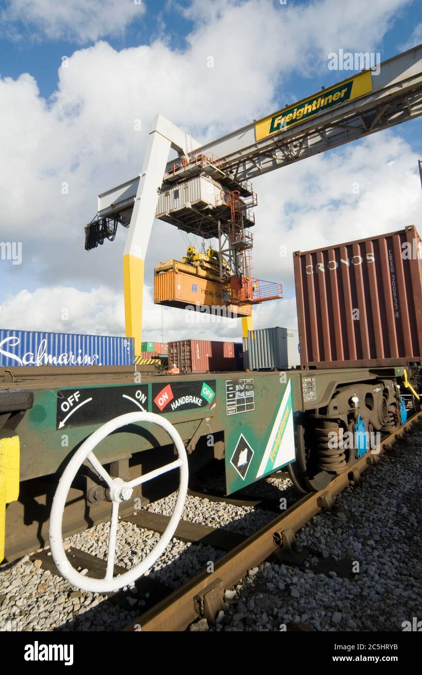 Rail mounted crane being used to load and unload shipping containers at ...