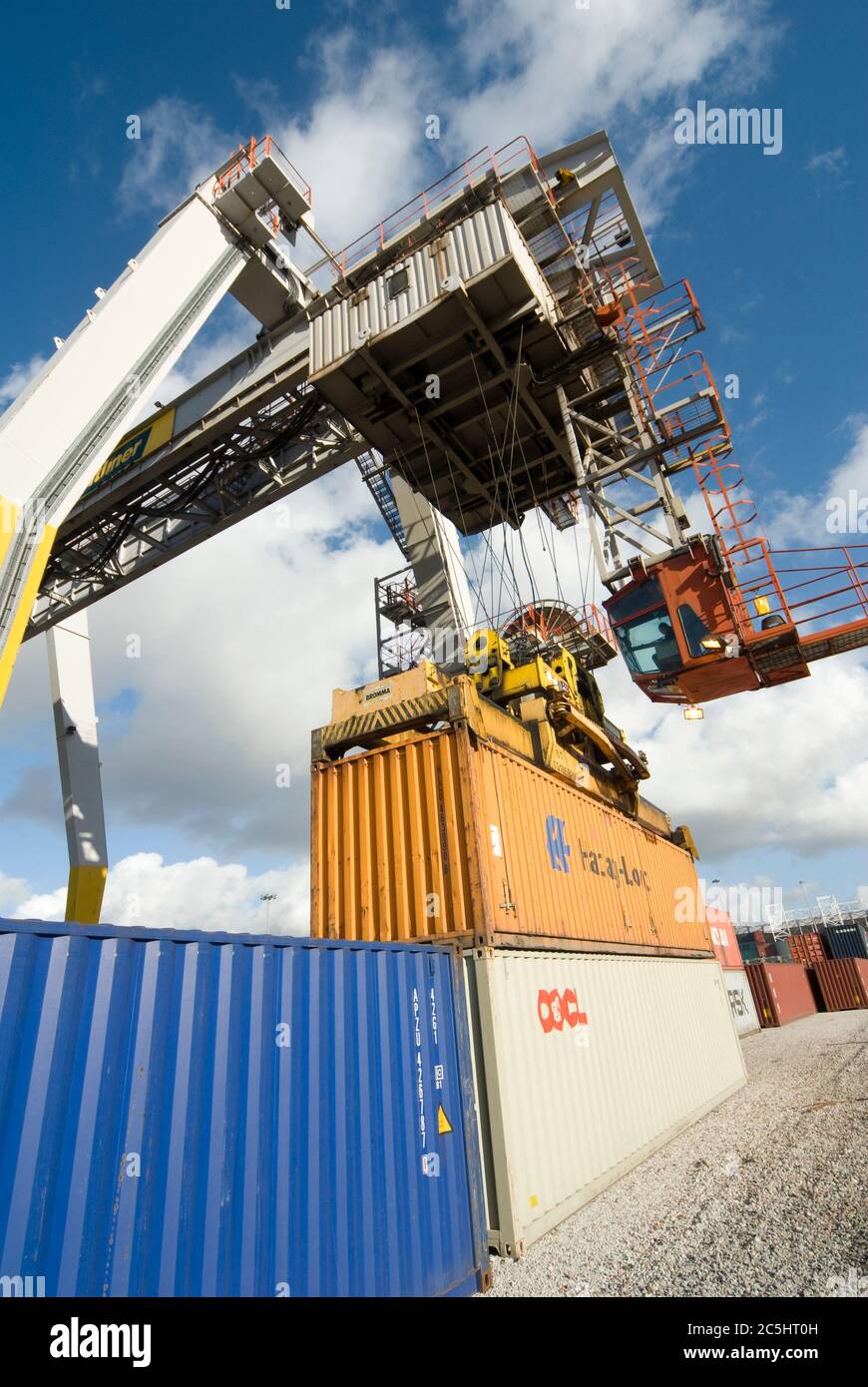 Rail mounted crane being used to load and unload shipping containers at ...