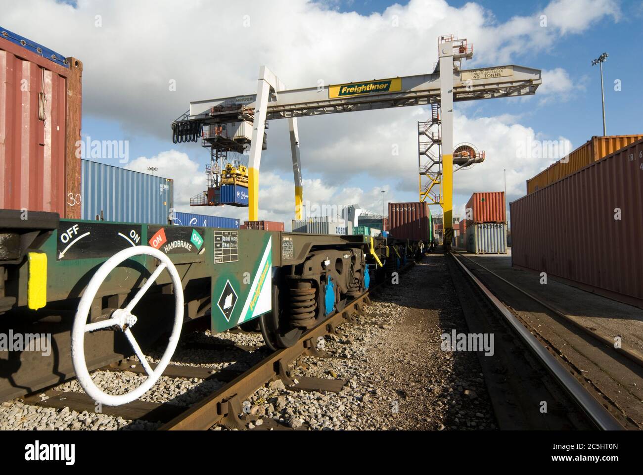 Rail mounted crane being used to load and unload shipping containers at ...