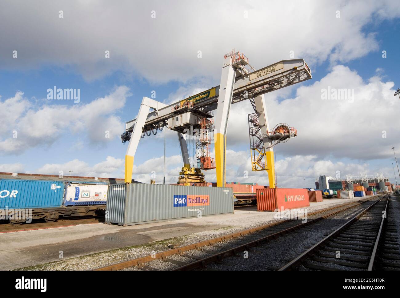 Rail mounted crane being used to load and unload shipping containers at ...