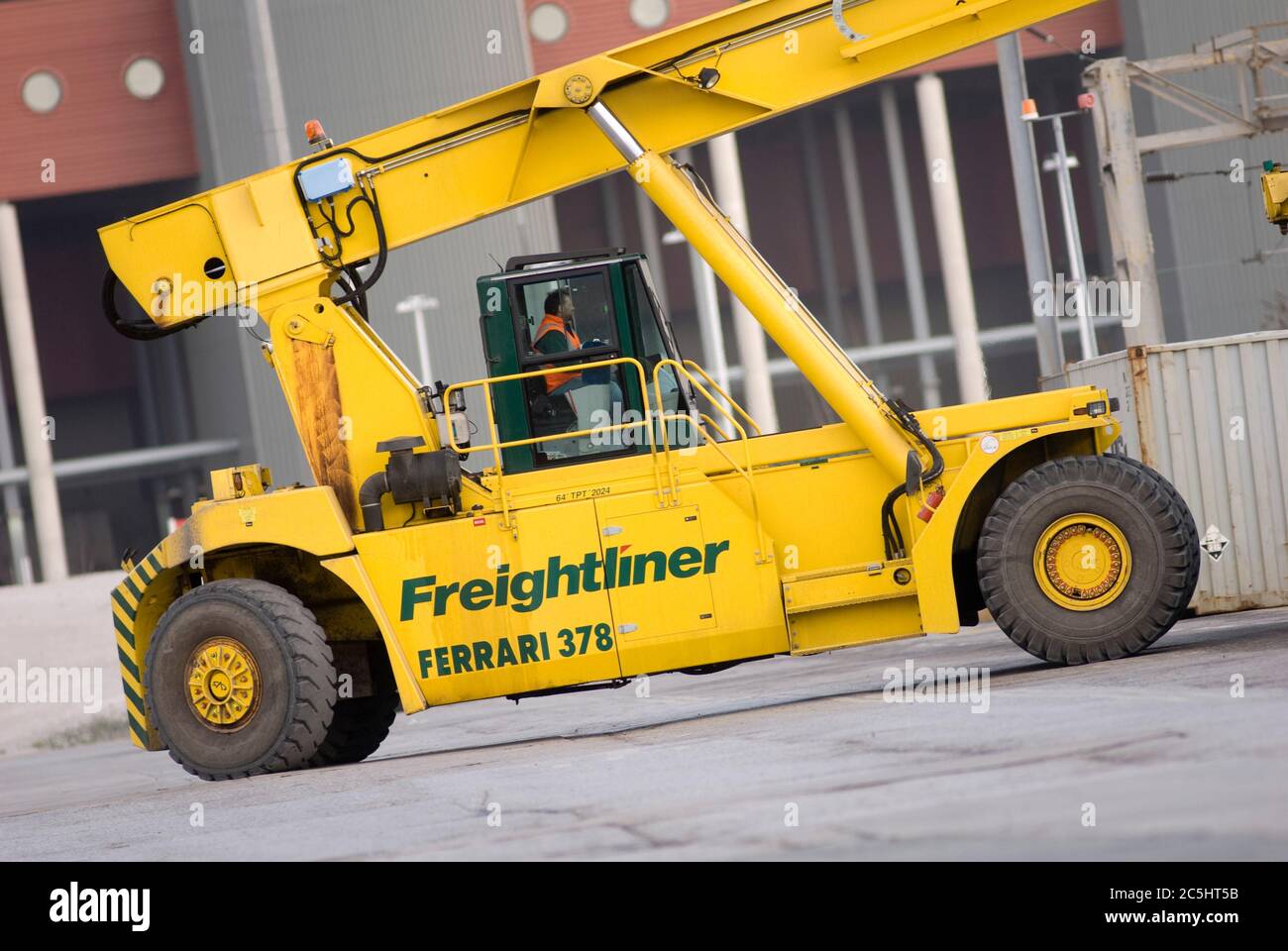 CVS Ferrari reach stacker being used to move shipping containers at ...
