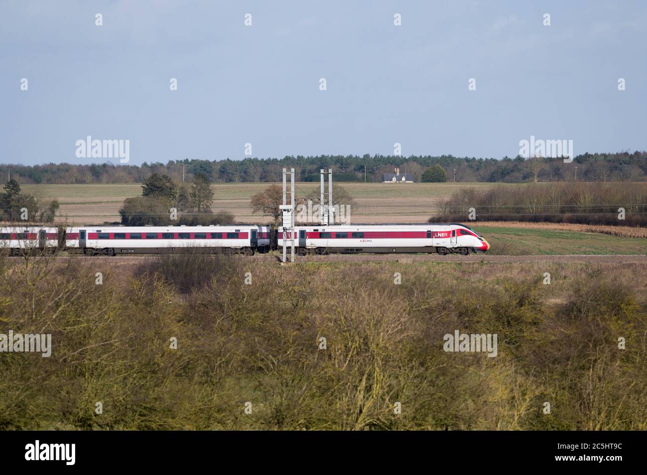 High speed train in LNER livery speeding through the English ...