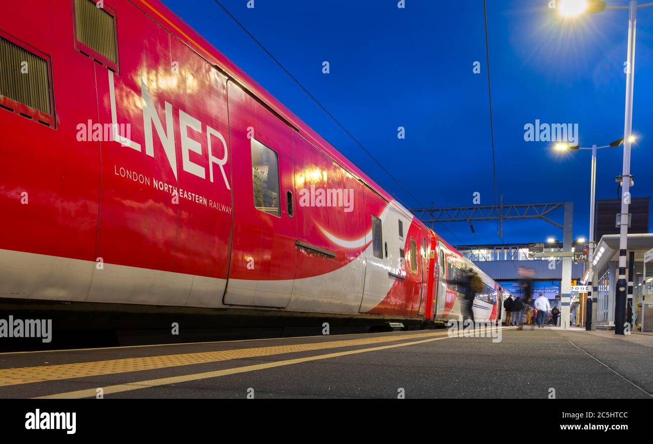 LNER high speed train waiting at a railway station on the east coast ...