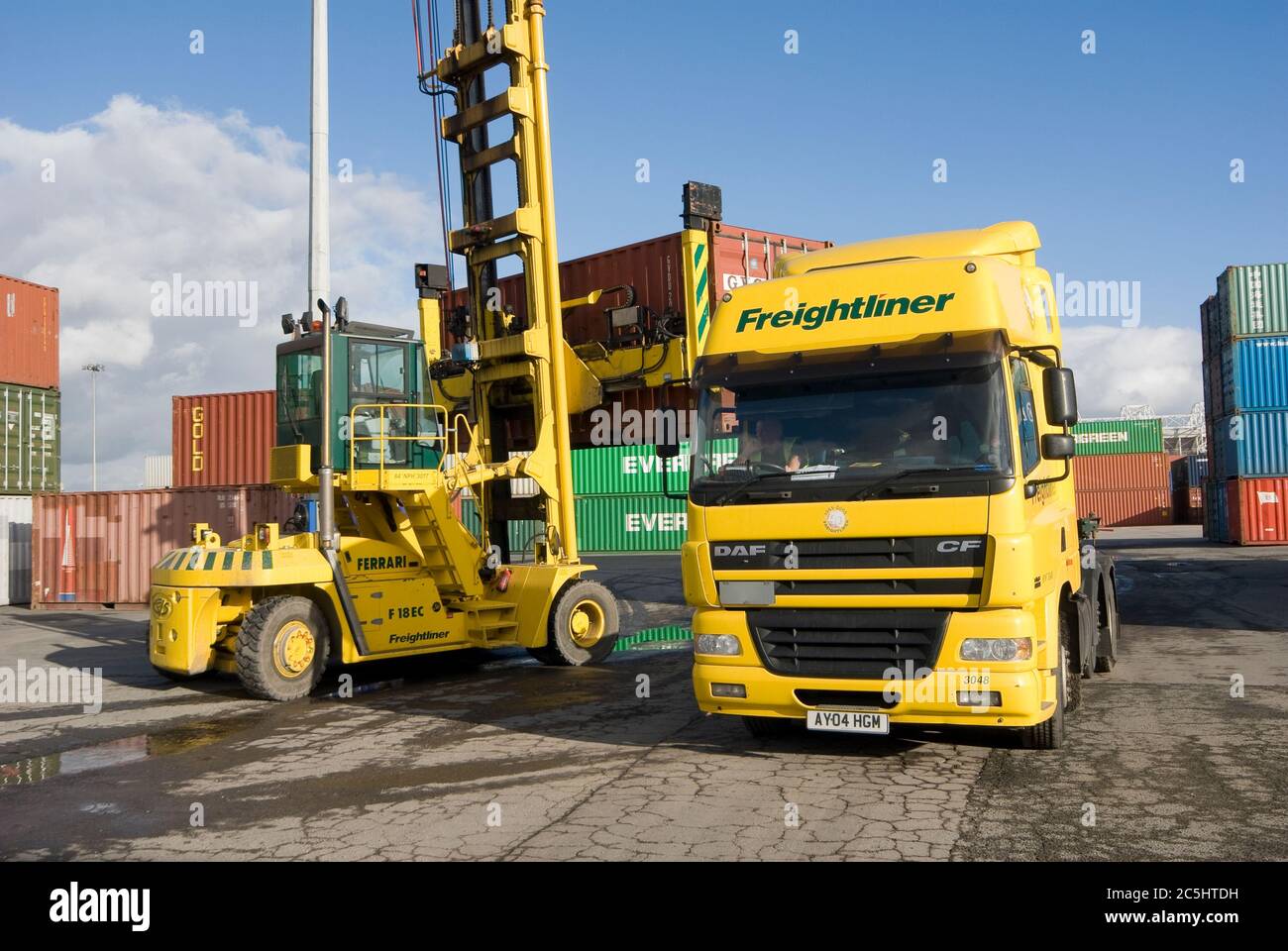 CVS Ferrari container handler being used to load a shipping container ...