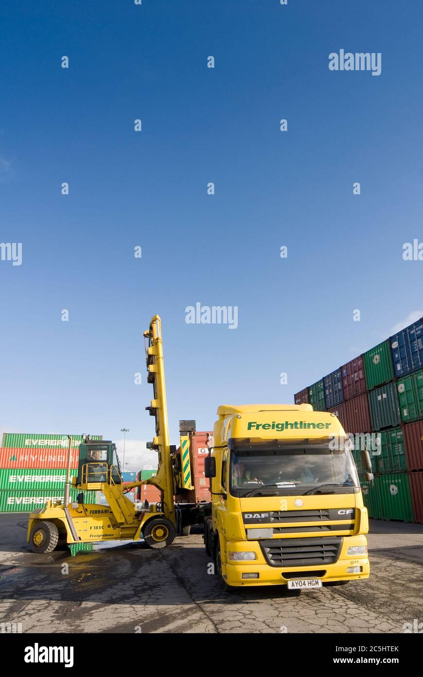 CVS Ferrari container handler being used to load a shipping container ...