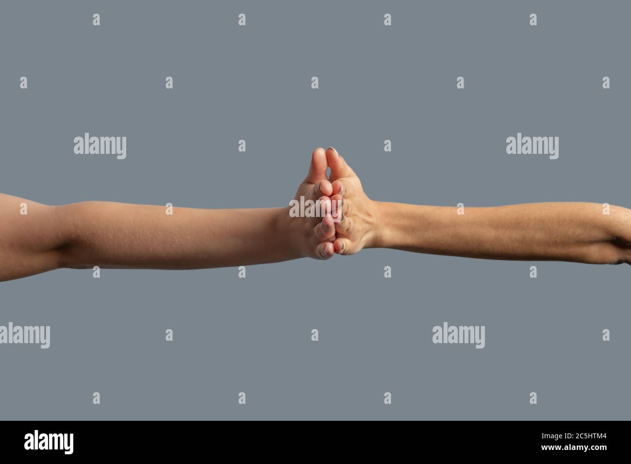 Different races holding hands hi-res stock photography and images - Alamy