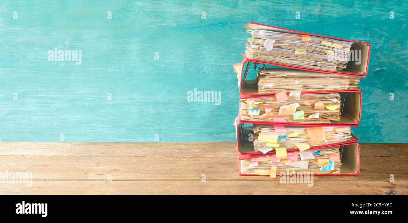 messy file folders and documents, bureaucracy and red tape concept ...