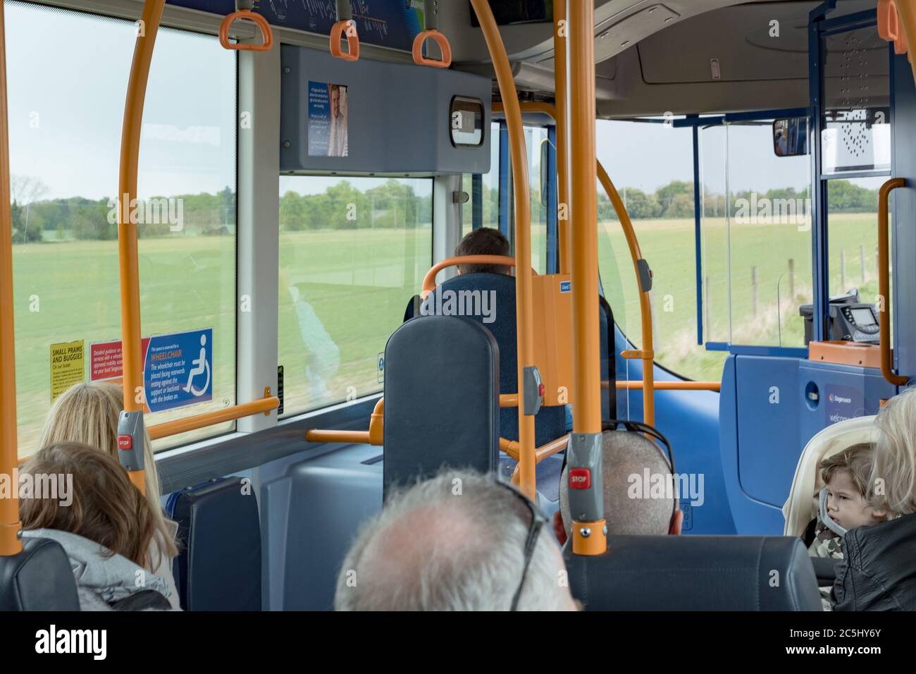 Park and ride bus interior, showing seated passengers travelling to ...